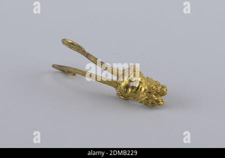 Mount. Head of a bearded satyr with long horns Stock Photo - Alamy