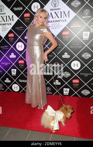 Christa Billich arrives on the red carpet for the Maxim magazine 5th ...