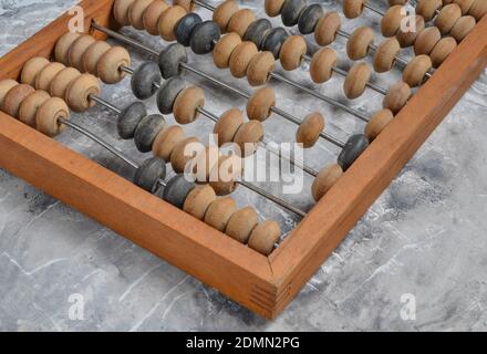 Ancient wooden abacus on a gray concrete background close up Stock ...
