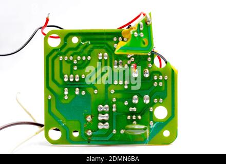 Cracked disassembled broken small vintage electronic device on white ...