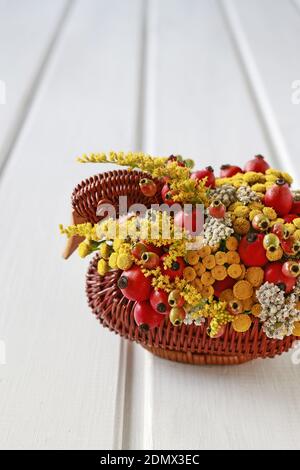 Bouquet of flowers in wicker goose. Table centerpiece idea for St ...
