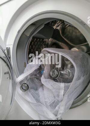 Washing machine filled with plastic waste representing micro plastic ...