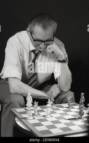 chess player plays at the chessboard Stock Photo - Alamy