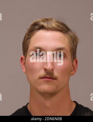 In a booking photo provided by the Michigan State Police, paramedic ...