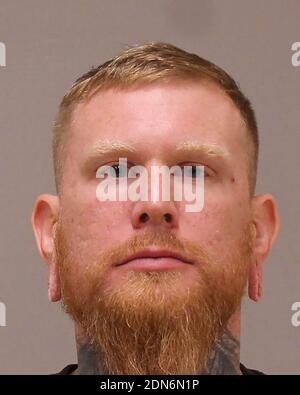 In a booking photo provided by the Michigan State Police, paramedic ...