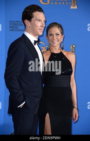 Benedict Cumberbatch (L) and Jennifer Aniston posing in the press room ...