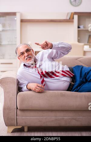Senior male boss employee coming home from work Stock Photo - Alamy