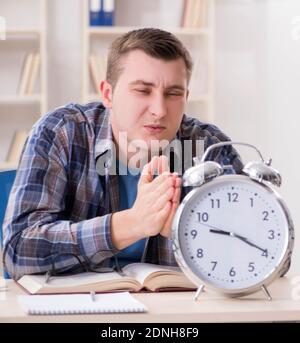 The student getting late with exam preparation Stock Photo - Alamy