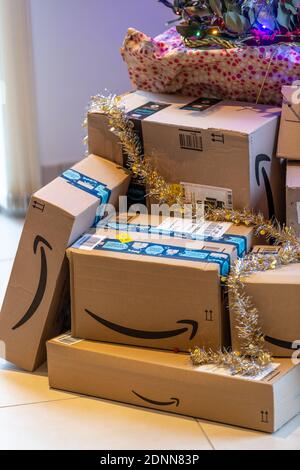 Amazon packages deposited at the foot of the Christmas tree Stock Photo ...