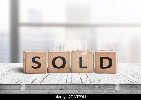 The word "Sold" written in white 3D letters on a colorful background ...