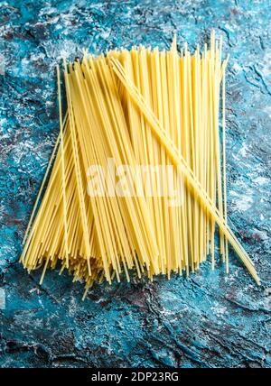Uncooked pasta shells on blue background food and drink concept Stock ...