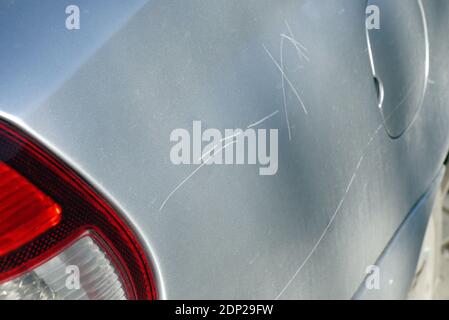 a scratched car hood, deep hood scratch Stock Photo - Alamy