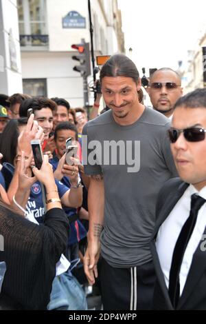 Zlatan Ibrahimovic signs autographs for his fan at Colette store for ...