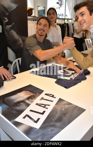 Zlatan Ibrahimovic signs autographs for his fan at Colette store for ...