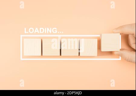 Loading, wood cube in progress bar Stock Photo - Alamy