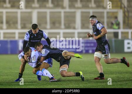 Ben Thomas of Cardiff rugby is tackled by Sam Crean of Ulster (1). EPCR ...