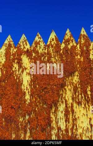 A closeup shot of a rusty texture under a blue sky Stock Photo - Alamy