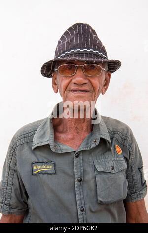 An elderly Cuban man wearing a hat, head and shoulders portrait, age ...