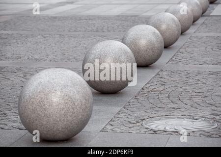 row of glossy granite balls decorative traffic barrier on the ...