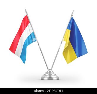 Ukraine and Luxembourg two flags on flagpoles and blue cloudy sky ...