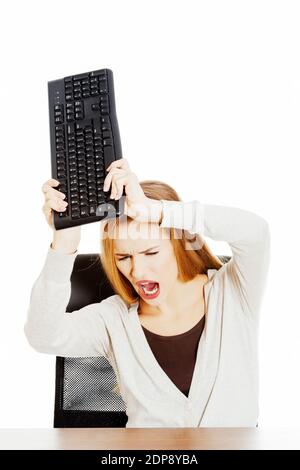 Angry Woman Breaking Keyboard Against White Background Stock Photo - Alamy