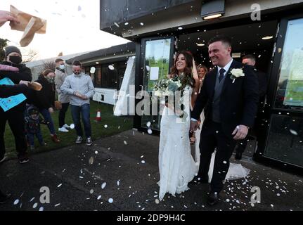 Emma Jesson and her new husband Adam Jesson are greeted by a small ...