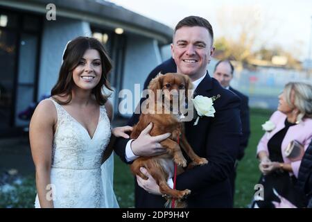 Emma Jesson and her new husband Adam Jesson are greeted by a small ...