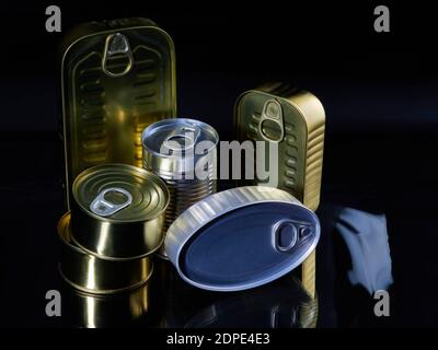 Different types of cans with prepared foods for consumption, vegetables ...