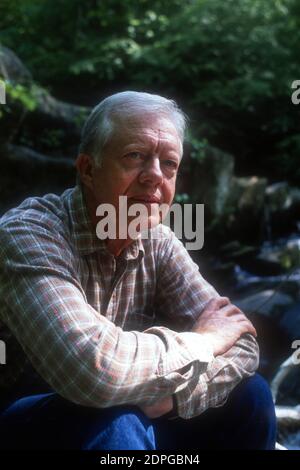 FILE - Former US President Jimmy Carter listens during a video ...