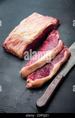 Raw ambassador beef steak cut, on black background Stock Photo - Alamy