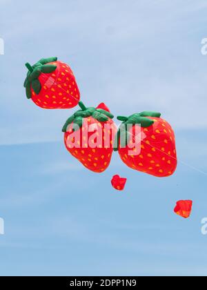 Strawberry kites, line laundry, on a blue sky background Stock Photo ...