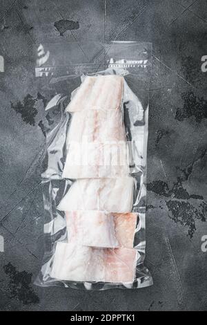 Haddock fish skinless in vacuum package, on white background with copy ...