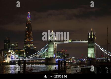 The Shard with special spire lights illuminating the London skyline and ...