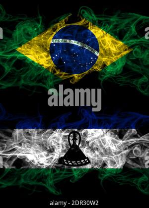 Lesotho and Brazil flag waving in the wind against white cloudy blue ...