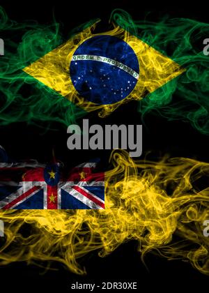 Niue and Brazil flag waving in the wind against white cloudy blue sky ...