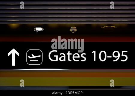Signs to gate numbers for boarding gates inside the airport terminal ...
