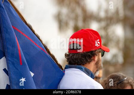 A supporter wears a "Make America Great Again" hat during a rally for ...