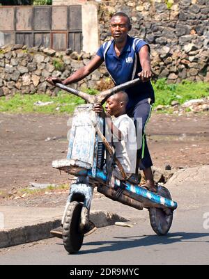 Wooden scooters in the image are called chukudu. They are common sight ...