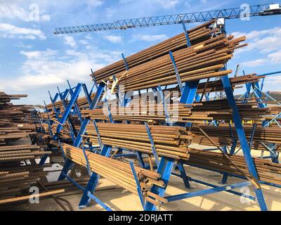 Metal reinforcement parts on metal racks at outdoor warehouse at ...