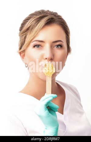 Hand holding paste on a white background Stock Photo - Alamy