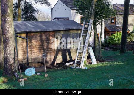 Maintenance on the roof of the smallholding water treatment shed ...