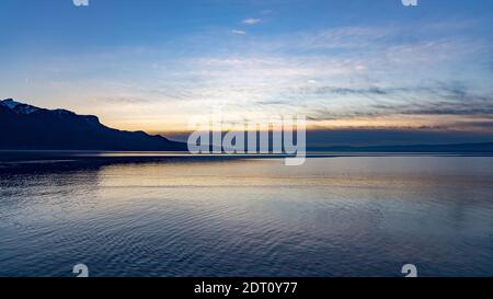 A mesmerizing view of a wavy lake on background of yellow and blue ...