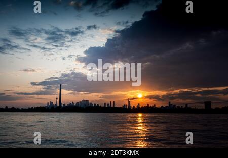 Scenic view of lake against sky during summer Stock Photo - Alamy