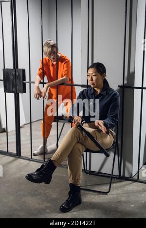 Asian women's prison. In the cell there are two young girls convicted ...