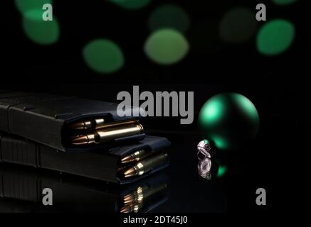 Loaded AR-15 magazines with green Christmas ornament behind Stock Photo ...