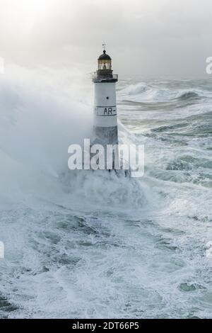 Ar-Men lighthouse during heavy storm off Brittany, western France on ...