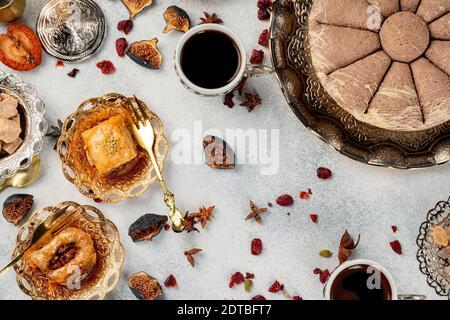 Turkish pastries and scattered dry fruits on table Stock Photo - Alamy