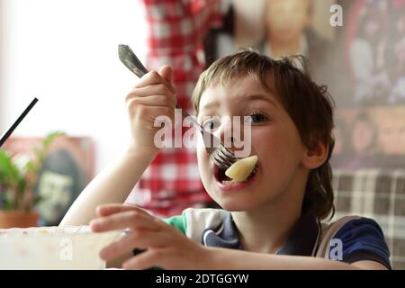 Boy eating dumplings in an ukrainian restaurant Stock Photo - Alamy