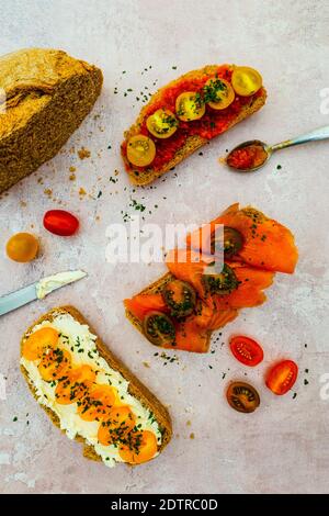 Open sandwiches made of brown integral bread. Slices of crunchy rounded ...