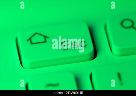 Close up detail of a Green highlighted enter key on a computer keyboard ...